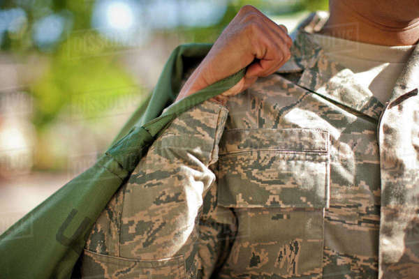 Duffel bag being carried by an army soldier. - Stock Photo - Dissolve