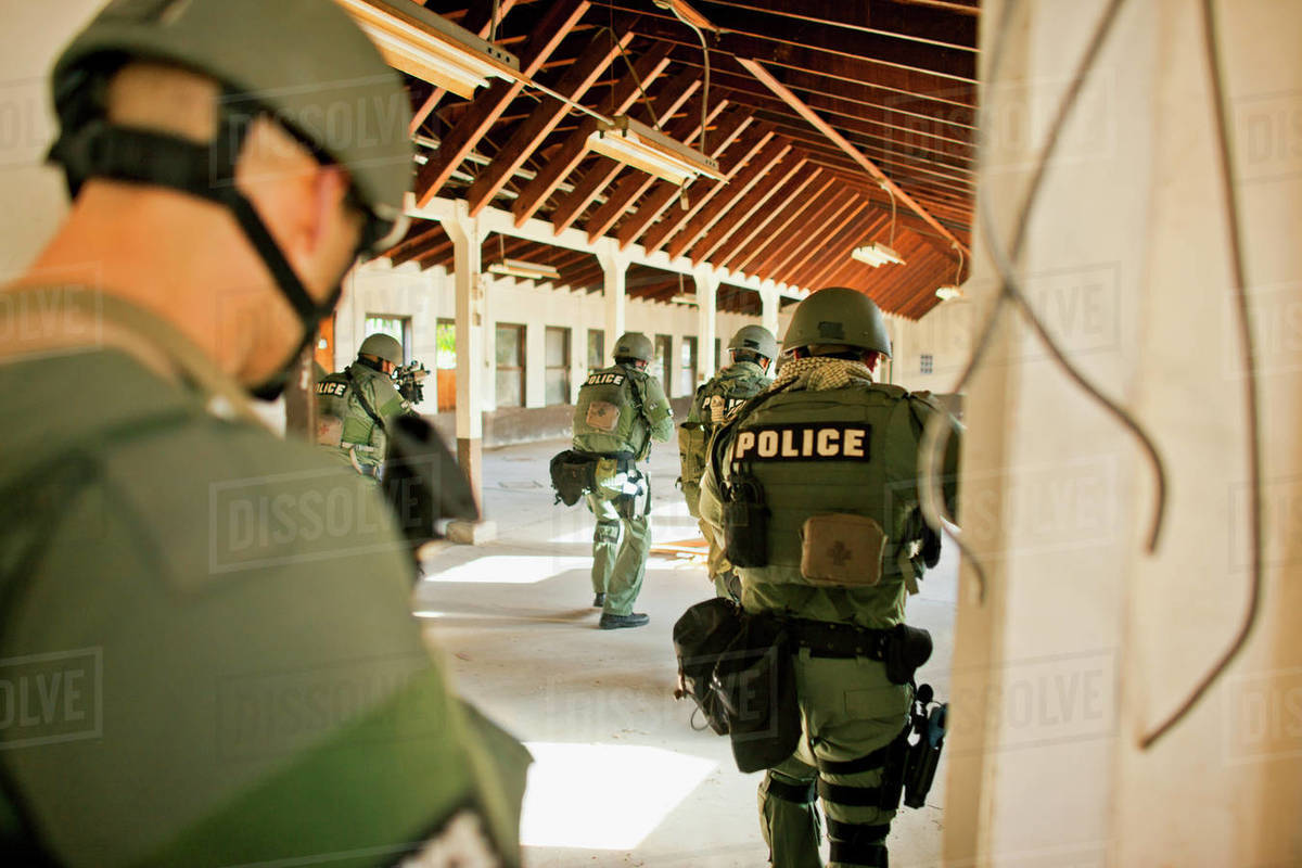 Group of police officers inside a building during an exercise at ...