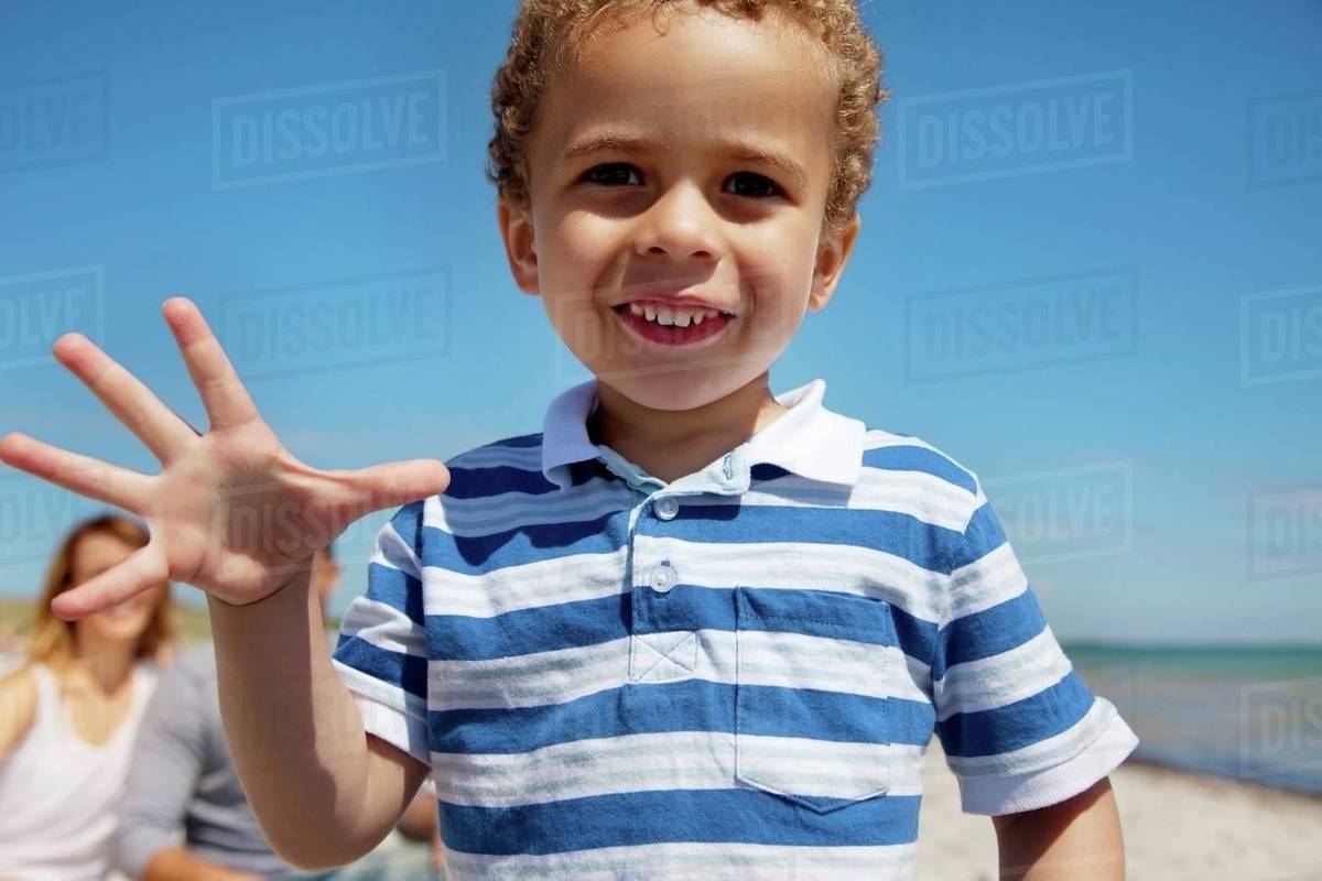 Closeup of an adorable and cute little kid enjoying the outdoors ...
