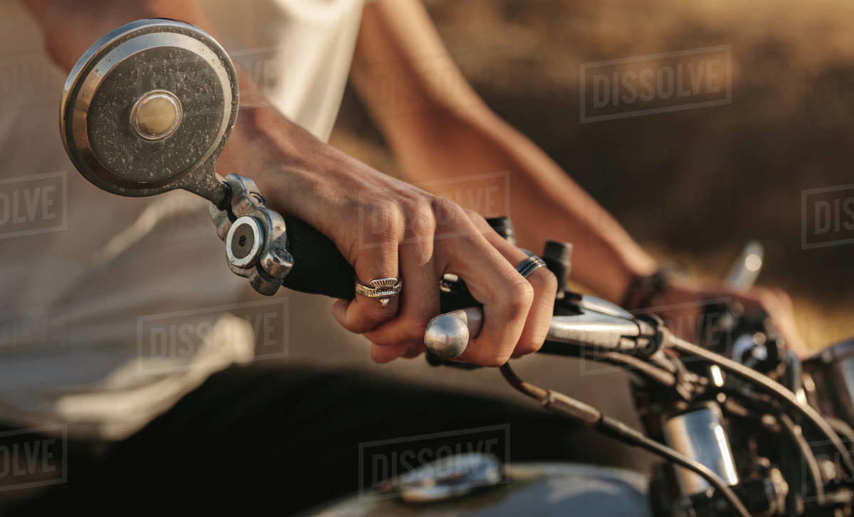 Close up of man holding the handlebars with the front brake lever. Male ...