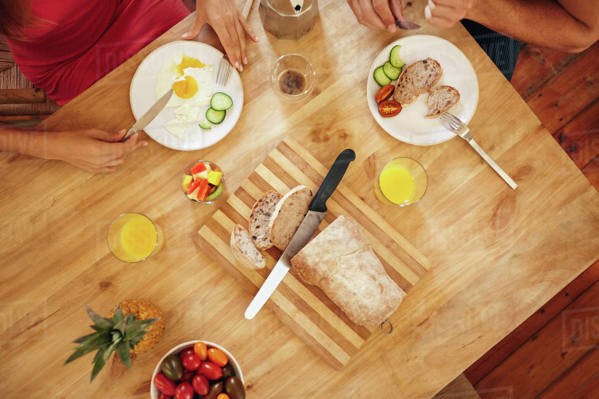 Top view of couple eating a healthy morning breakfast at home ...