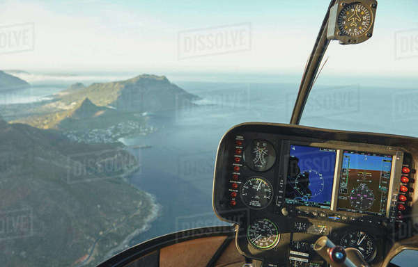 Aerial view from a helicopter cockpit flying over Cape town. Interior ...