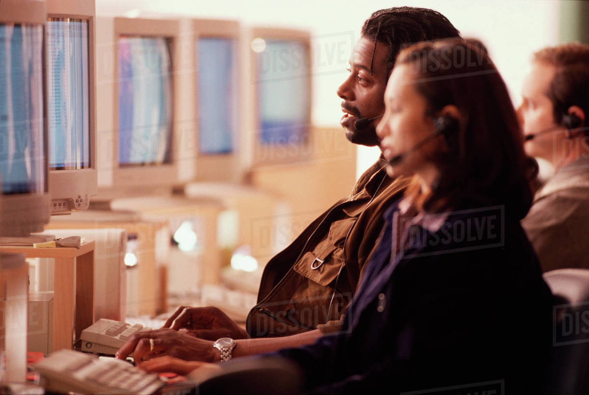 Multi-ethnic businesspeople working in call center - Royalty-free Stock ...
