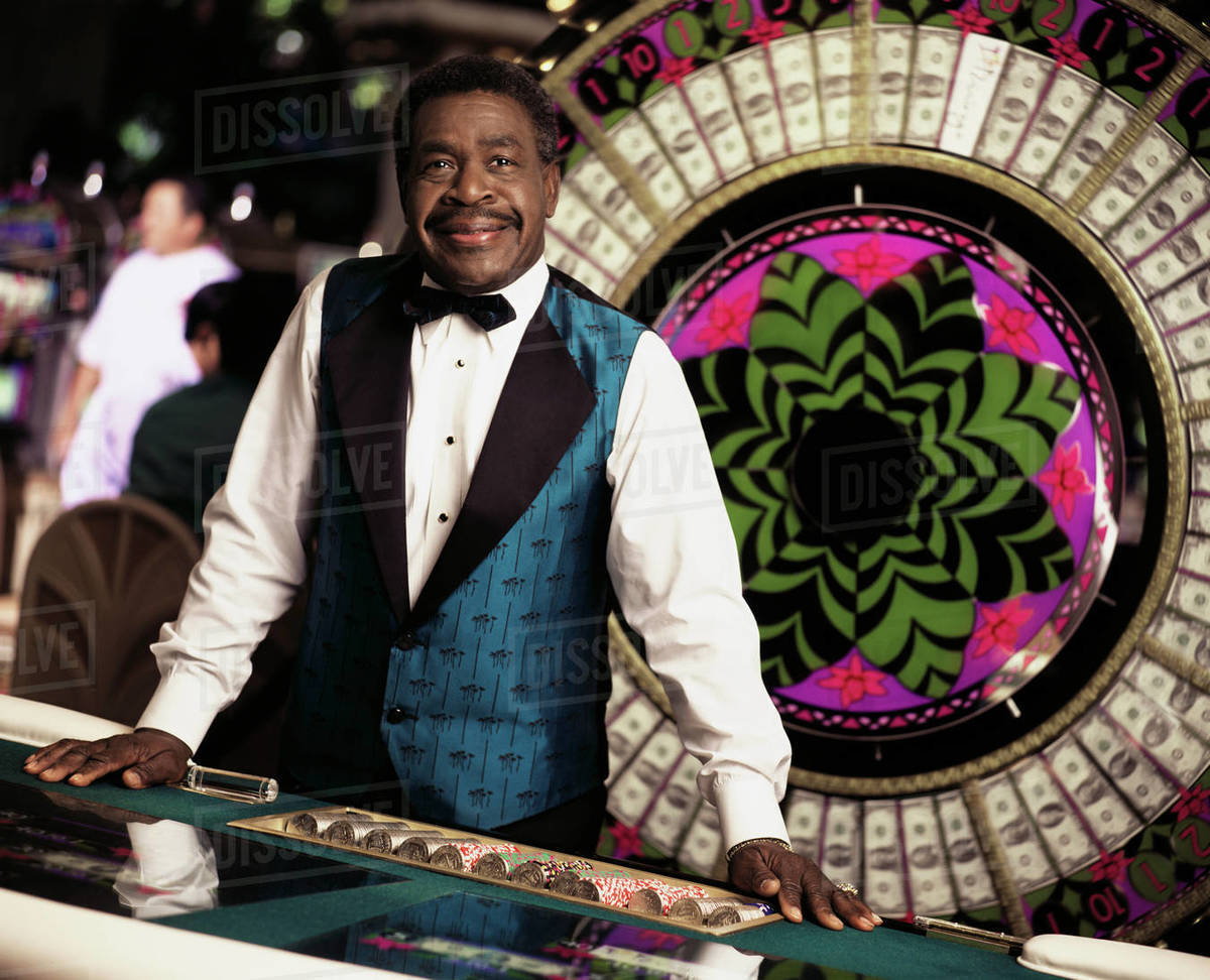 Male dealer at roulette wheel - Royalty-free Stock Photo | Dissolve