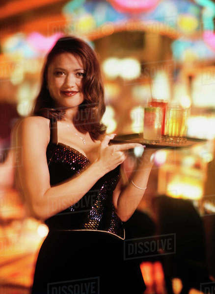 Female waitress with cocktails - Royalty-free Stock Photo | Dissolve