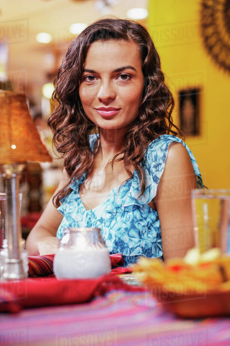 Portrait of woman sitting in restaurant - Royalty-free Stock Photo ...