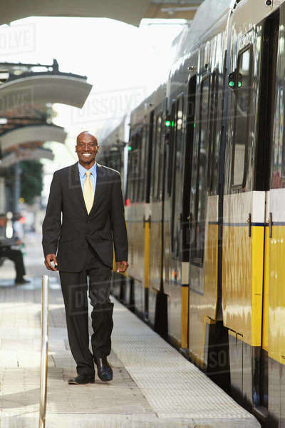 African American businessman on train platform - Royalty-free Stock ...