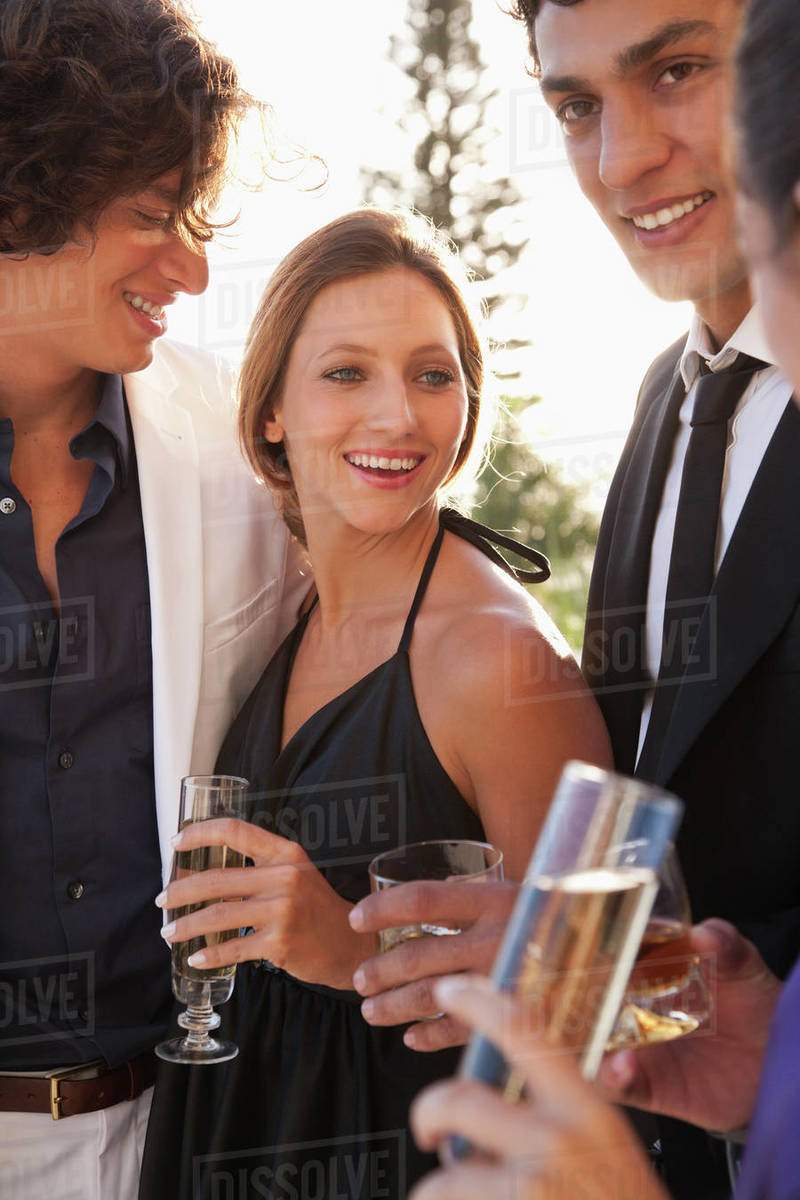Friends drinking champagne together at party - Royalty-free Stock Photo ...