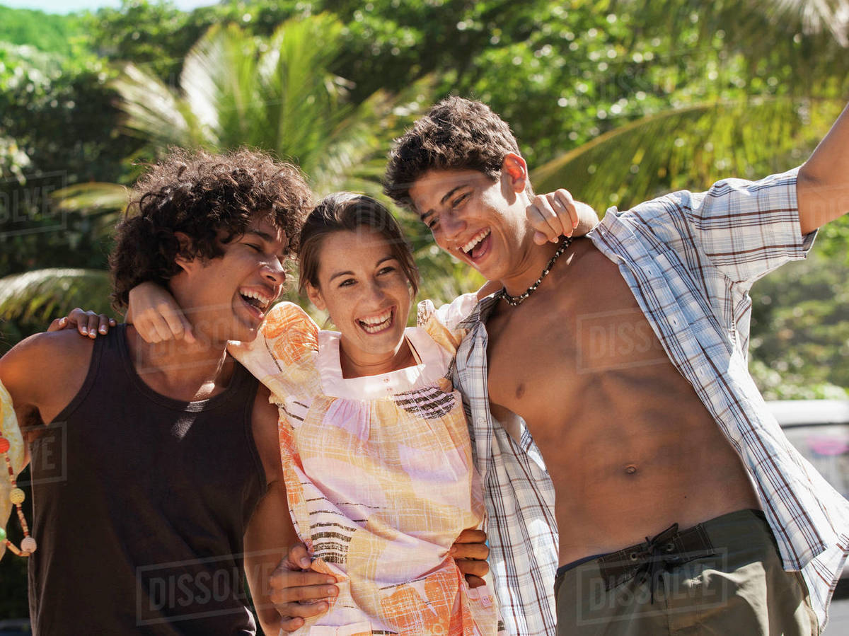 Friends laughing together outdoors - Stock Photo - Dissolve