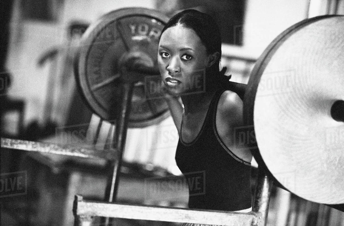 African woman weight lifting - Royalty-free Stock Photo | Dissolve