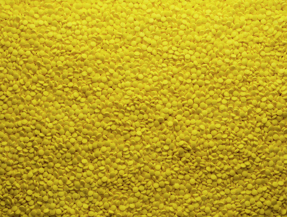 Bright yellow pills - Royalty-free Stock Photo | Dissolve