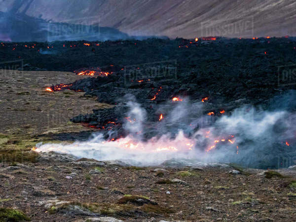 Tundra fire along lava front, Fagradalsfjall volcanic eruption at ...