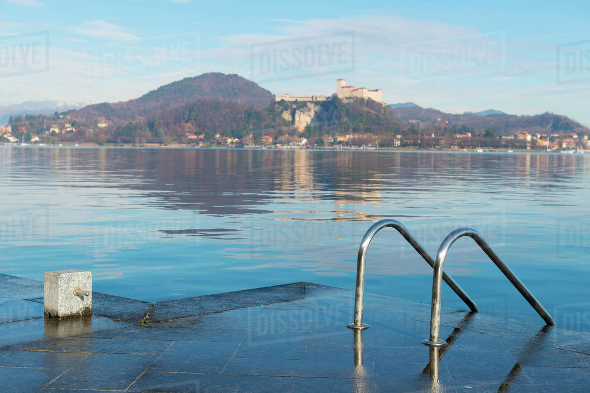 Waterfront and Castle Rocca Borromea di Angera on Lake Maggiore in ...