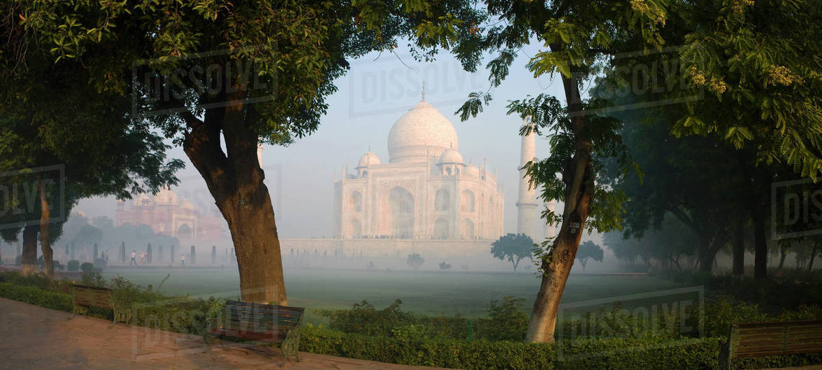 Trees in a park with a mausoleum in the background, Taj Mahal, Agra ...