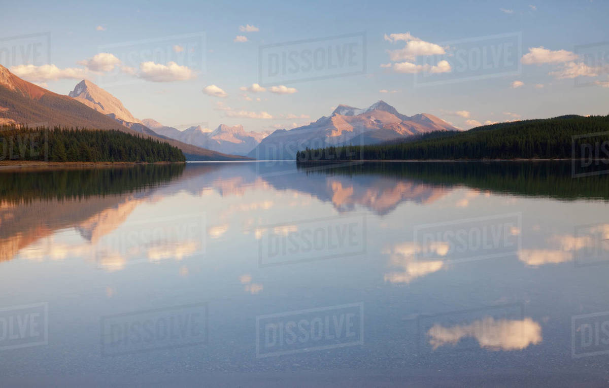 Reflection of clouds in a lake, Maligne Lake, Jasper National Park ...