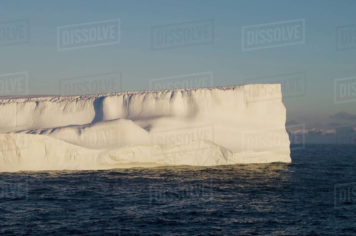 Iceberg floating on water - Royalty-free Stock Photo | Dissolve