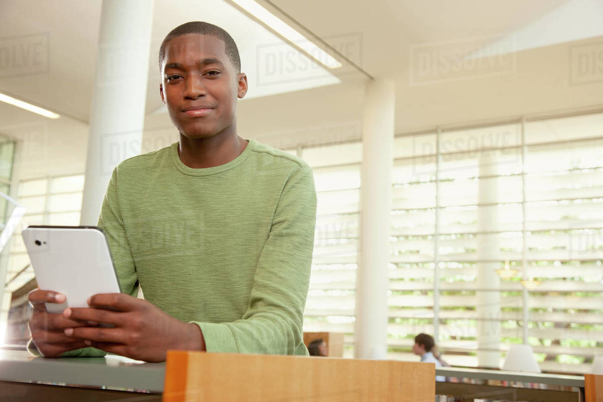 Portrait of proud Black male college student looking into camera and ...