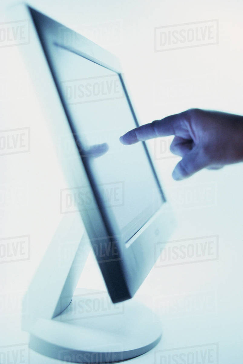 Person's finger pointing to a computer monitor - Royalty-free Stock ...