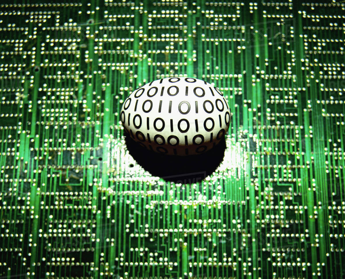 Close-up of an egg with the binary code on a circuit board - Royalty-free Stock Photo | Dissolve