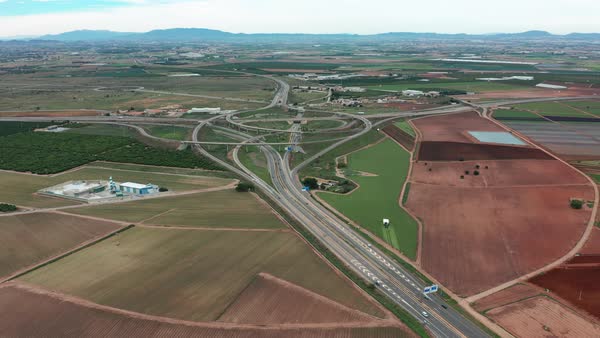 Aerial view. Road traffic highway and overpass with cars and trucks ...