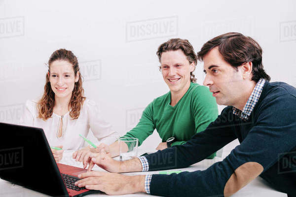 Group of office workers at a meeting around the boss - Royalty-free ...