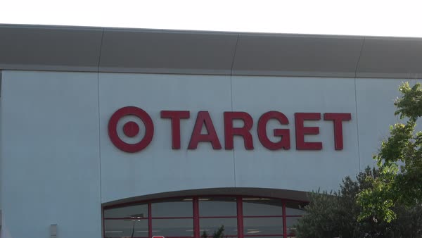 Zoom into sign with logo on facade of Target department store in Dublin ...