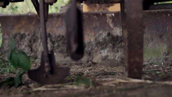 Several smooth tracking crane shots with rack focus from one machine to ...