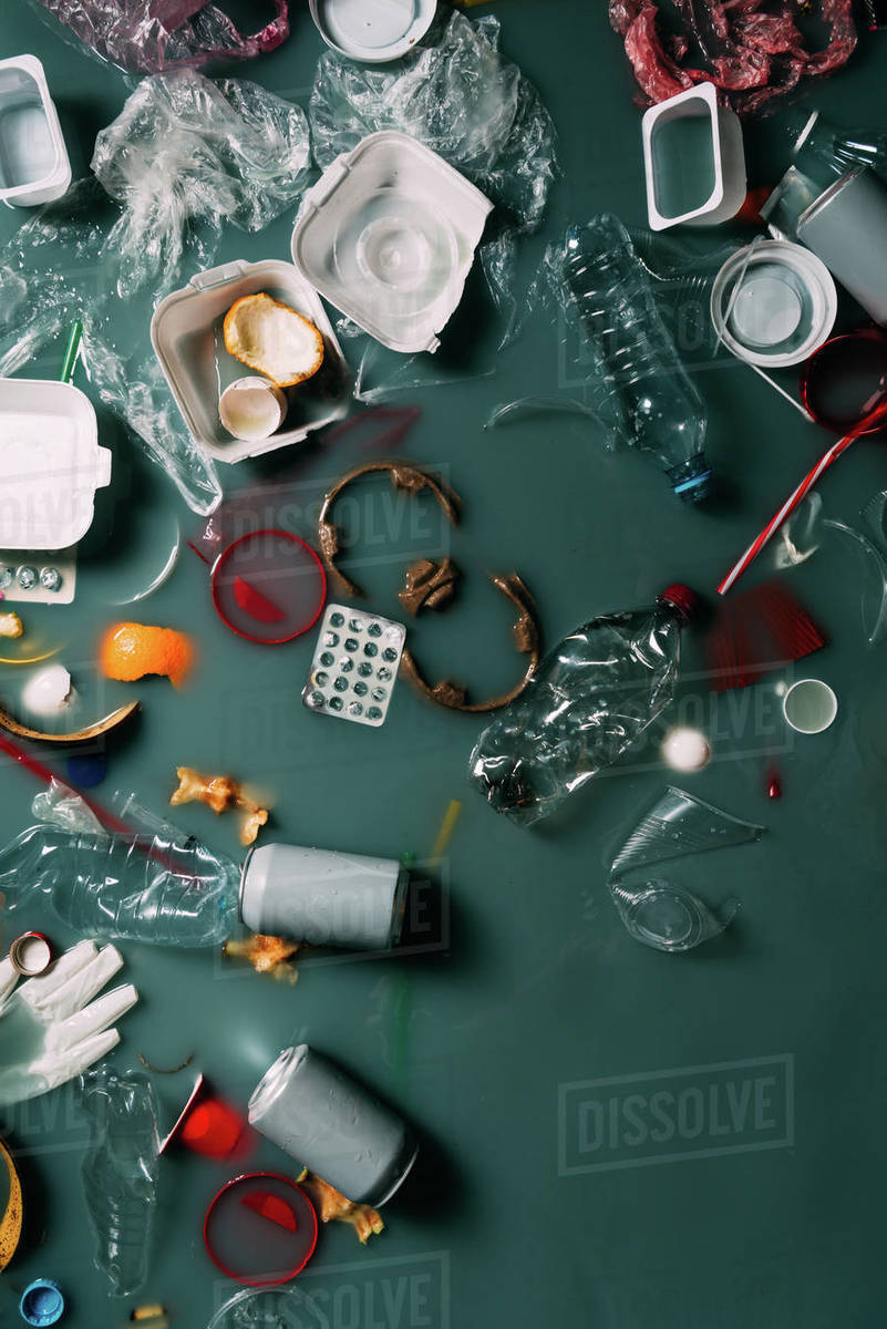 Top view of trash and leftovers flowing in water, environment ...
