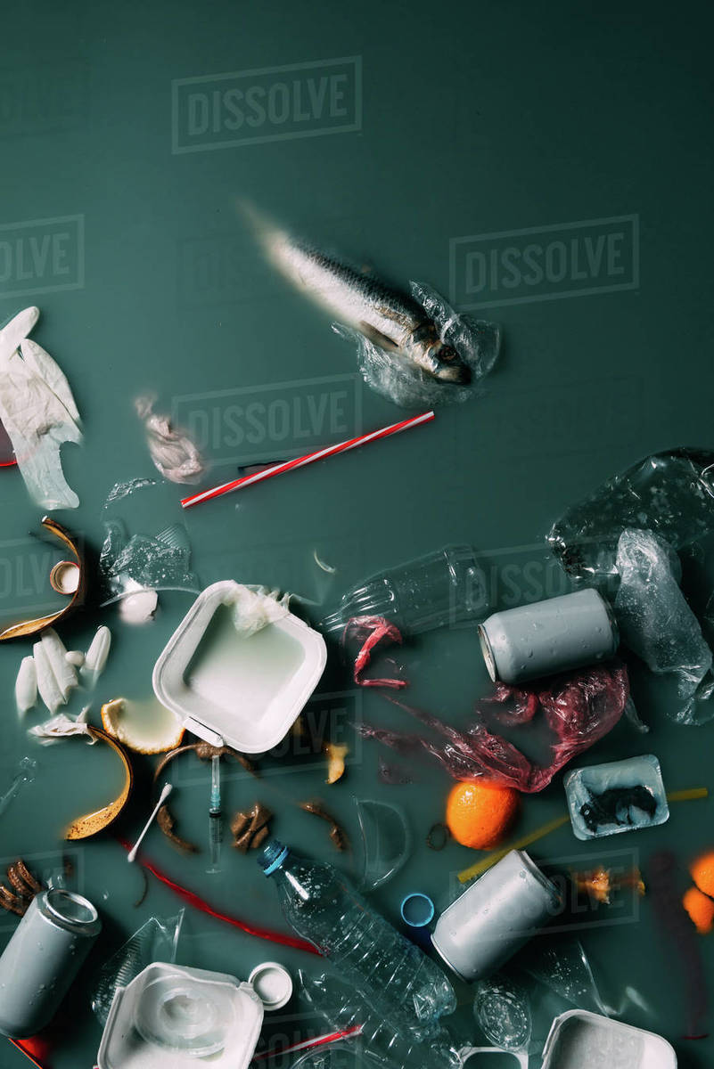 Top view of trash and leftovers flowing in water, environment ...