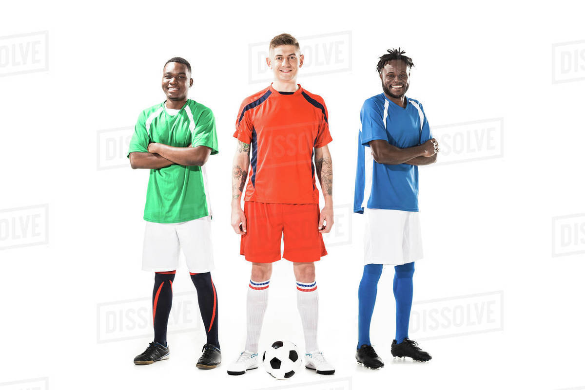confident young multiethnic soccer players standing together and ...