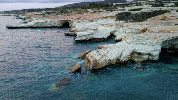 Aerial view of white rocks on seashore with blue water, Cyprus ...