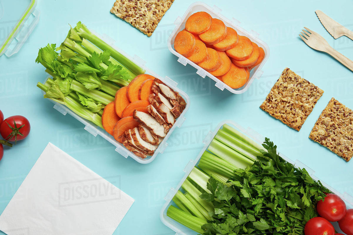 top view of arrangement of food containers with fresh healthy food ...