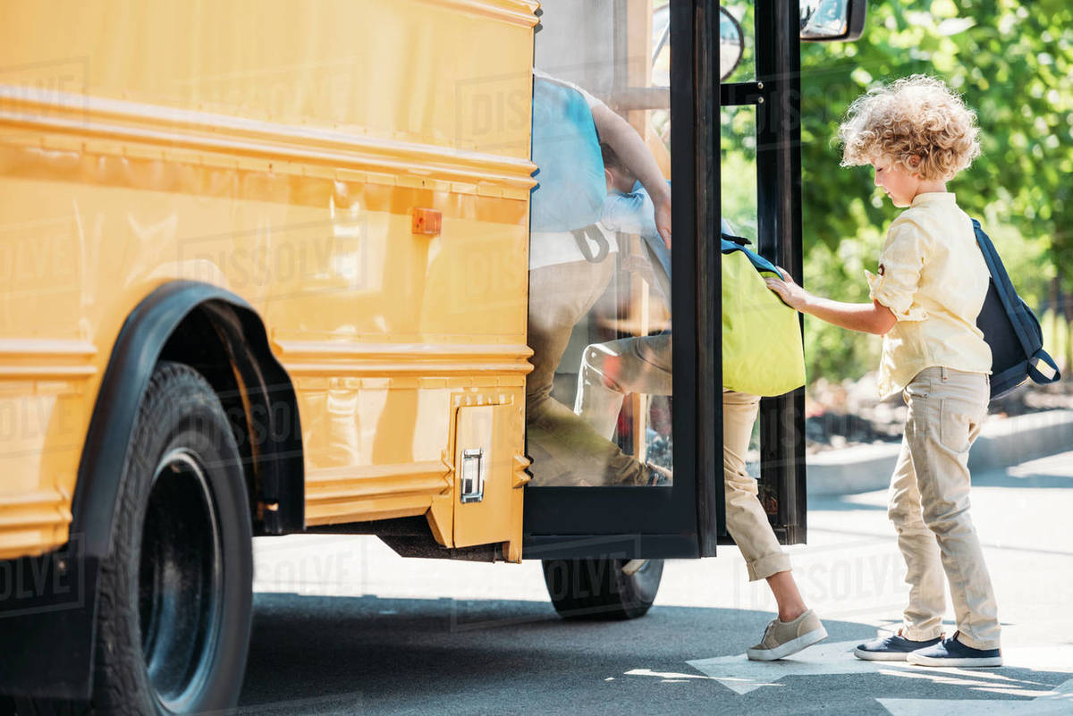 group of little schoolboys entering school bus - Royalty-free Stock ...