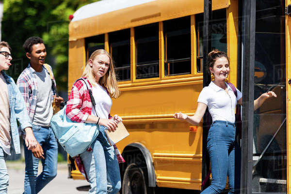 group of teen students entering school bus after lessons - Stock Photo ...