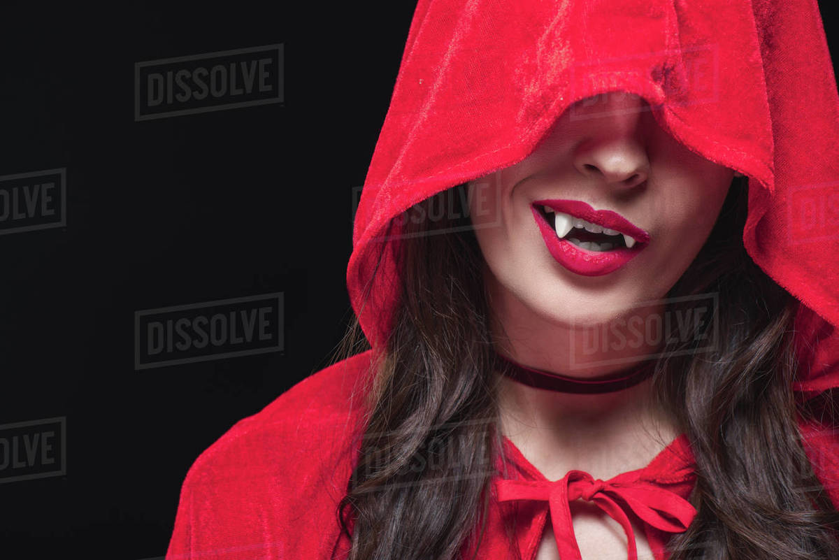 Vampire woman in red cloak isolated on black - Royalty-free Stock Photo ...