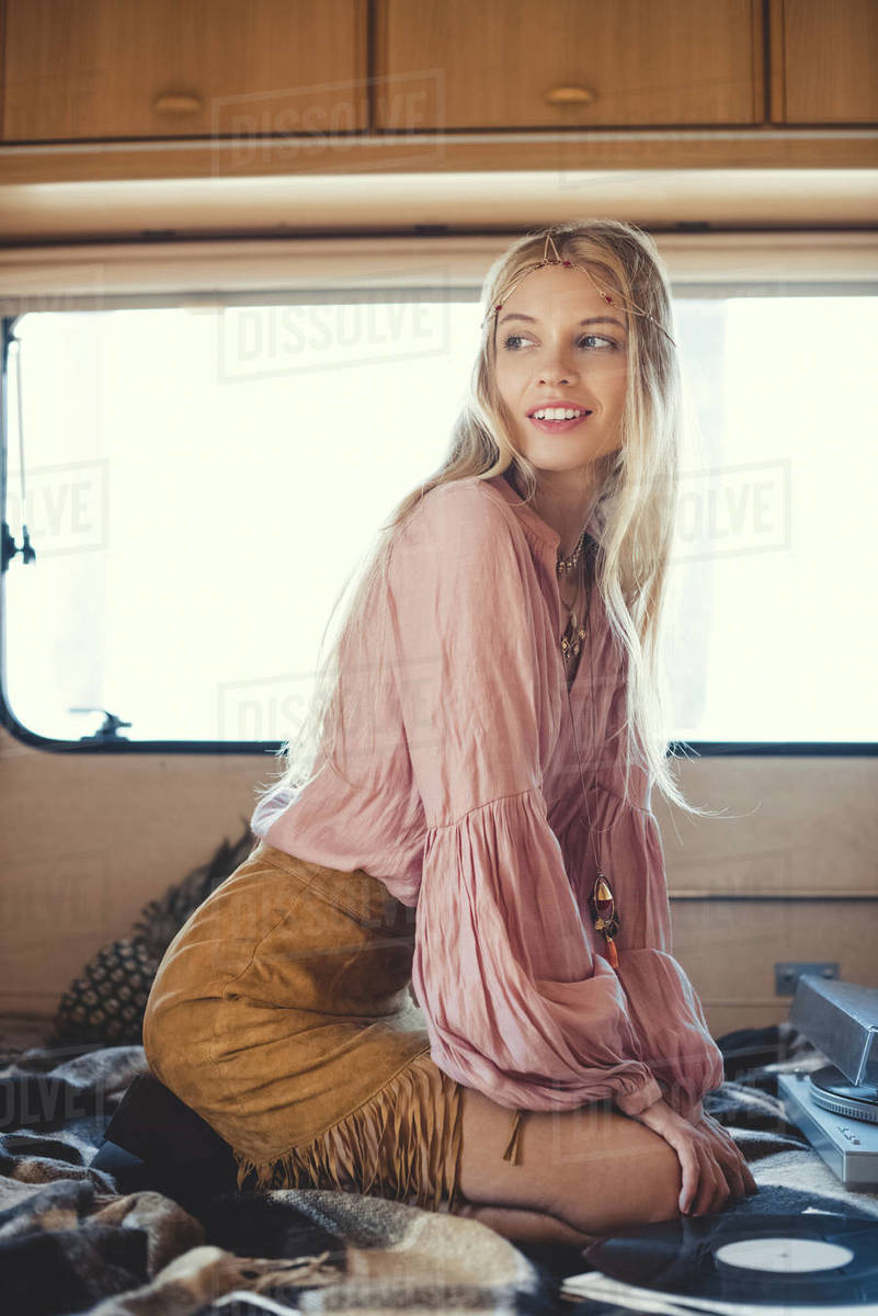 Attractive smiling girl with vinyl player inside camper van - Royalty ...