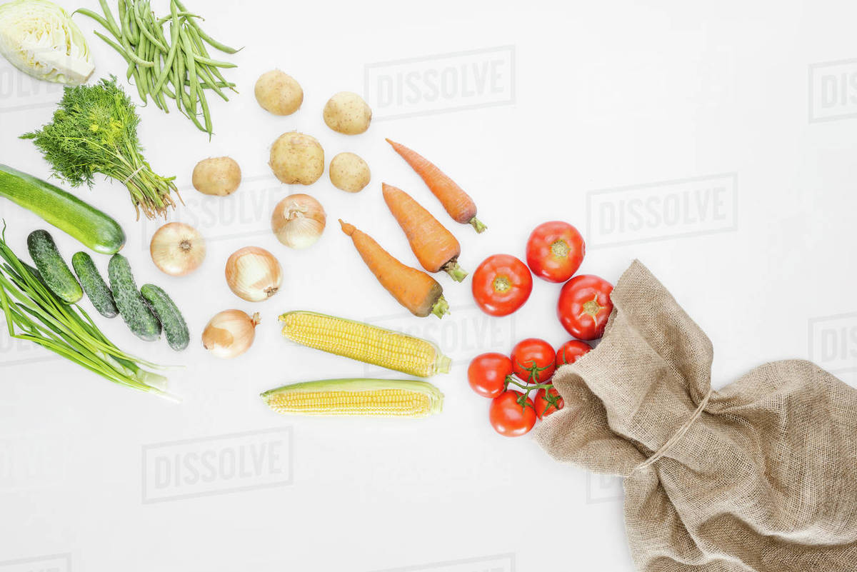 Top view of fresh raw vegetables and sackcloth arranged isolated on ...