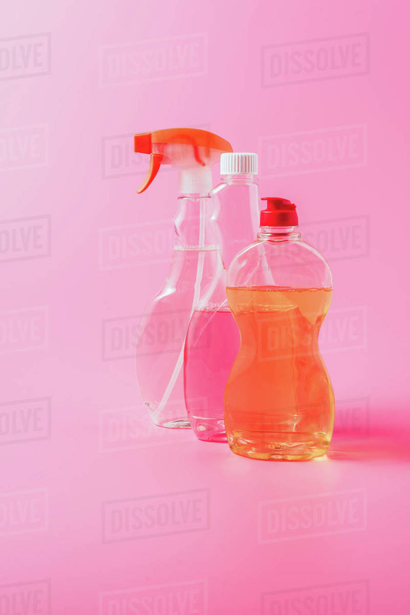 close up view of dishwashing liquid and cleaning fluids, pink ...