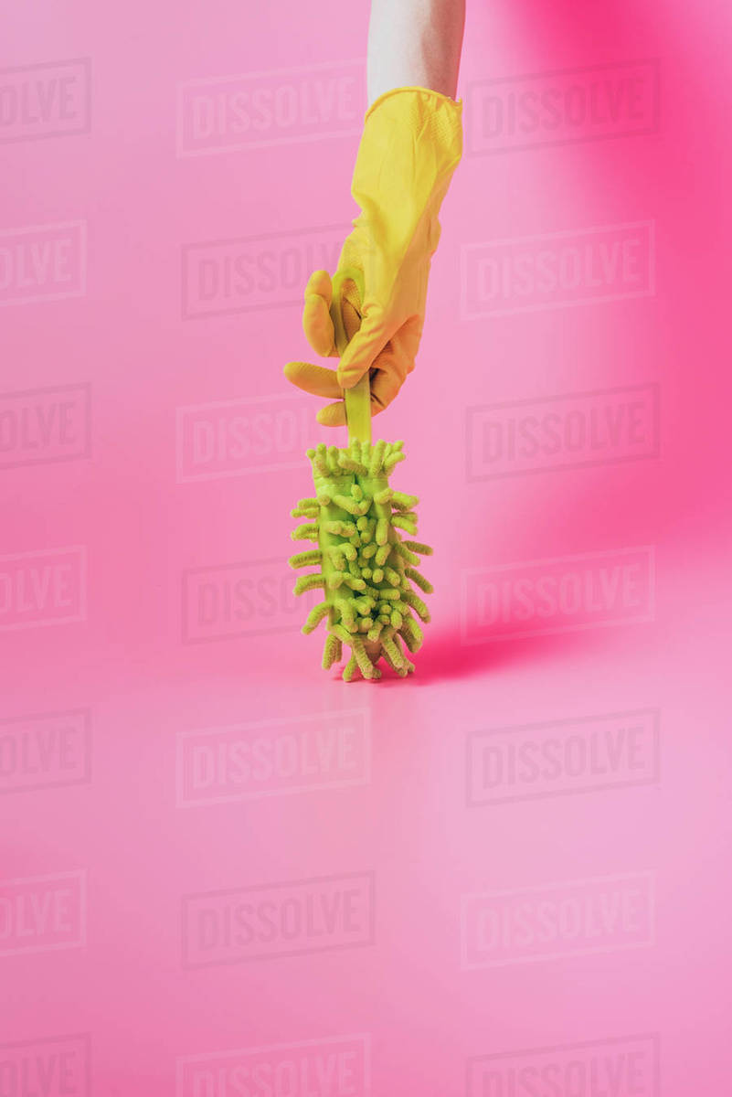 cropped image of female cleaner in rubber glove holding dish microfiber ...