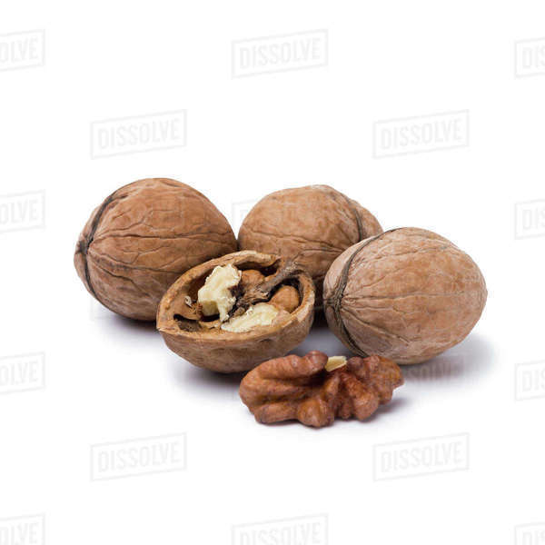 Handful of walnuts isolated on white background - Stock Photo - Dissolve