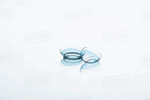 Close up view of contact lenses arranged on white backdrop - Royalty ...