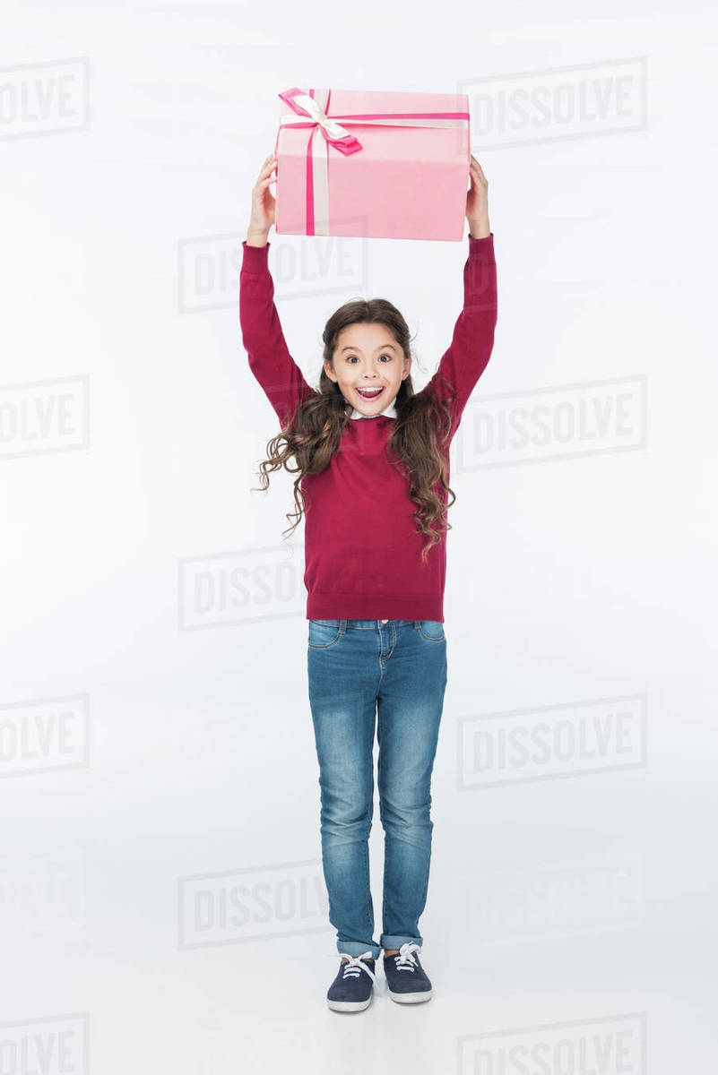 Happy kid with present looking at camera isolated on white - Stock ...