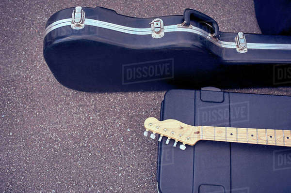 Close up view of musical instruments in cases lying on street - Royalty ...
