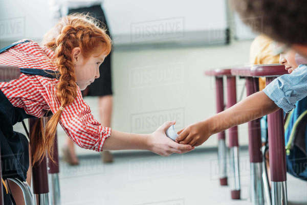 schoolgirls passing message in class on lesson - Royalty-free Stock ...