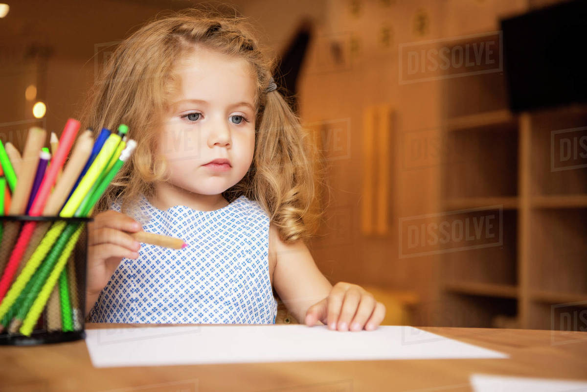 Adorable child holding felt pen for drawing in kindergarten, pen holder ...