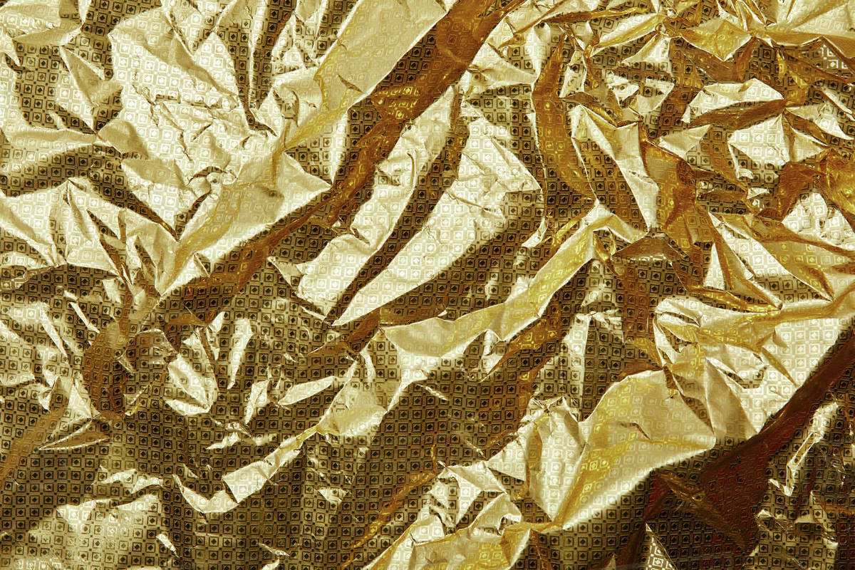 Full frame of shiny crumpled golden wrapping paper as background ...