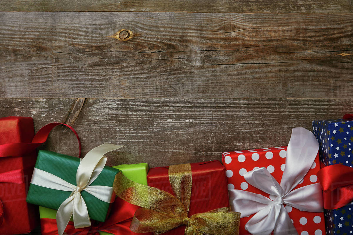 Flat lay with presents wrapped in different wrapping papers with ...