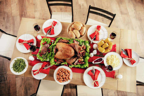 Elevated view of served table with delicious dishes and wine for ...