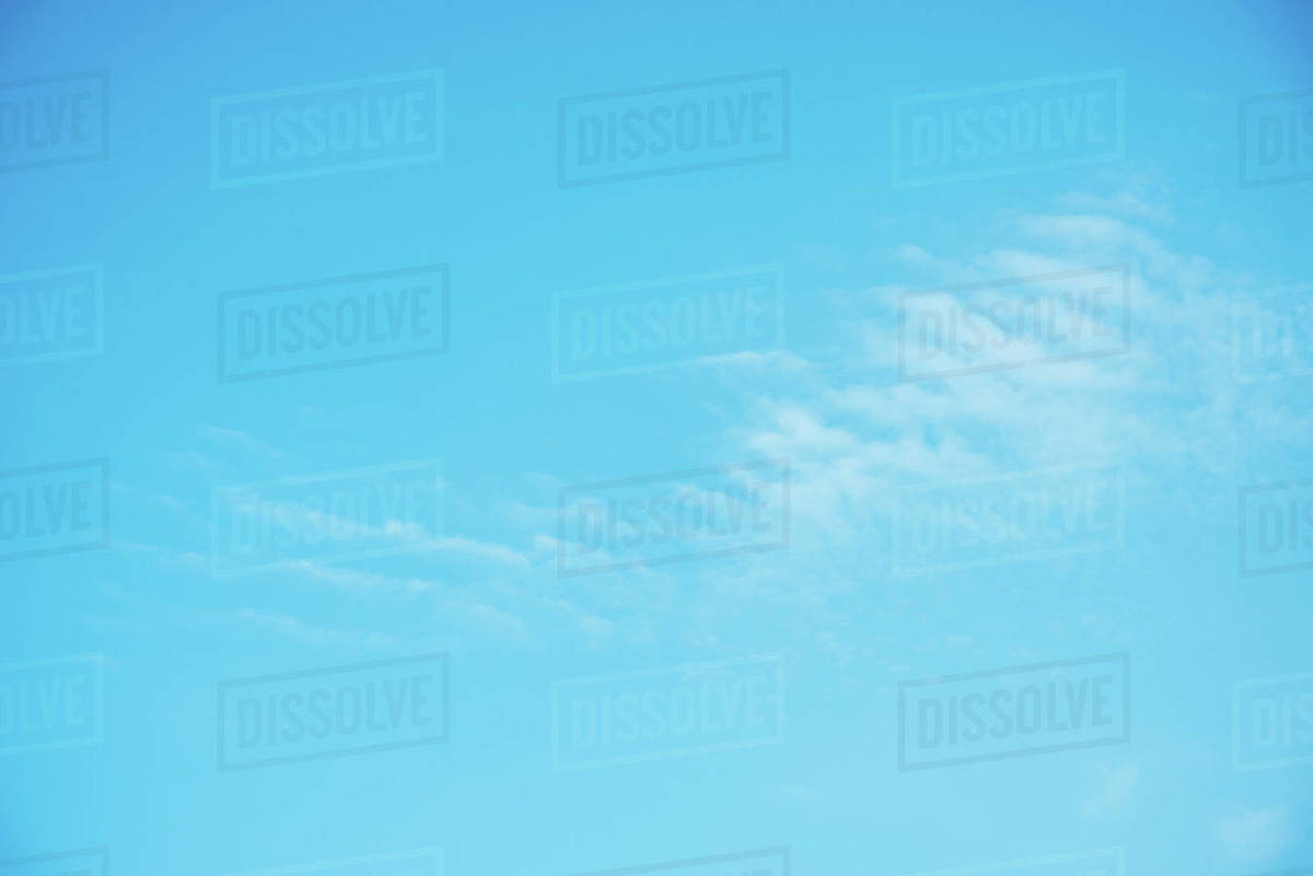 Beautiful light blue sky with clouds as background - Stock Photo - Dissolve
