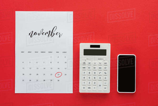 Top view of calendar for November, calculator and smartphone isolated ...